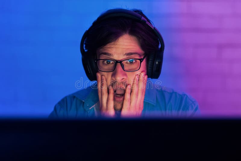 Shocked Gamer in Front of Computer Screen with Headphones on Stock ...