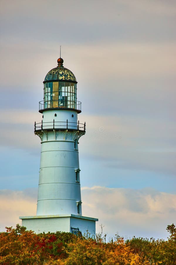 Detail of Large Iconically Shaped Lighthouse in Fall Forest with Cloudy ...