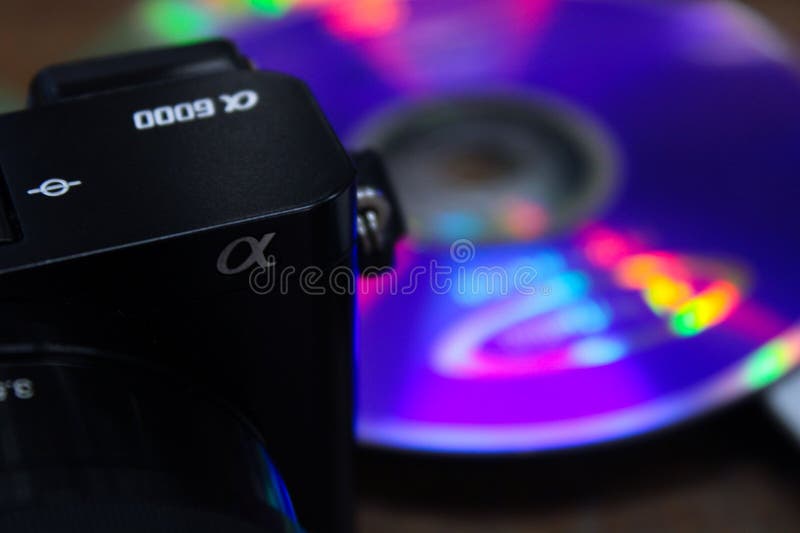 Is an Image of a Digital Camera with Several DVD Disks in the ...