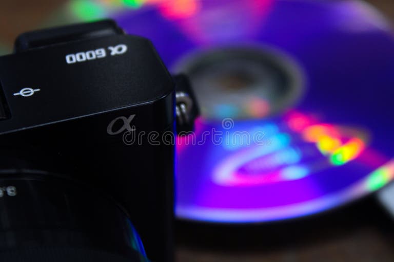 Is an Image of a Digital Camera with Several DVD Disks in the ...