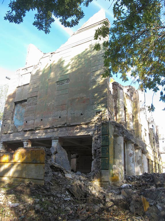 An Image of a Dilapidated, Multi-storied Building with Overgrowth and ...