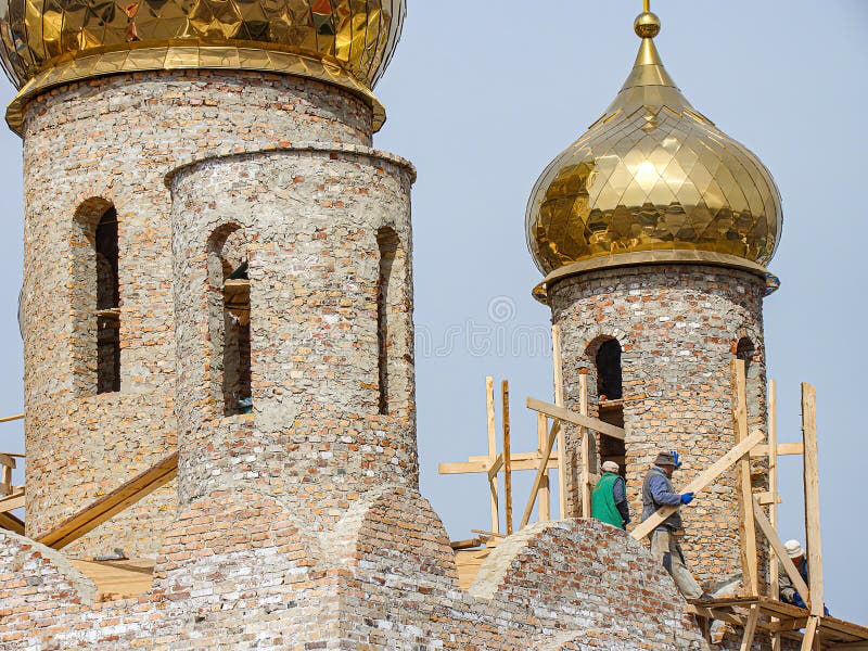 Image Displays a Construction Site with Two Structures, One a Tall ...