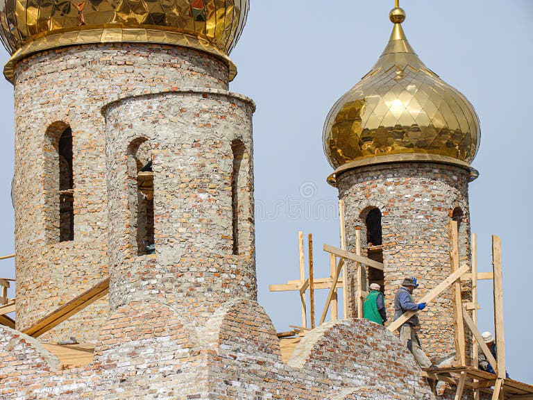 Image Displays a Construction Site with Two Structures, One a Tall ...