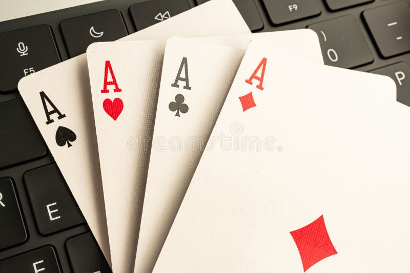 Image Displays Four Aces from a Deck of Playing Cards before a Computer ...