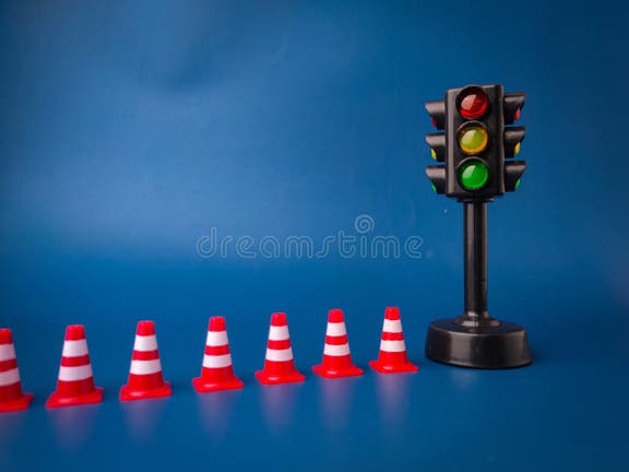 The Image Displays a Miniature Traffic Light and Several Miniature ...