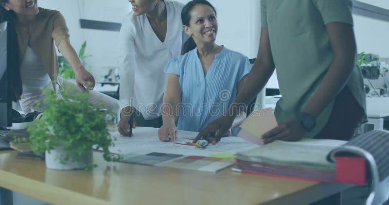 Image of Diverse Team Collaborating on Project in Office Stock Image ...