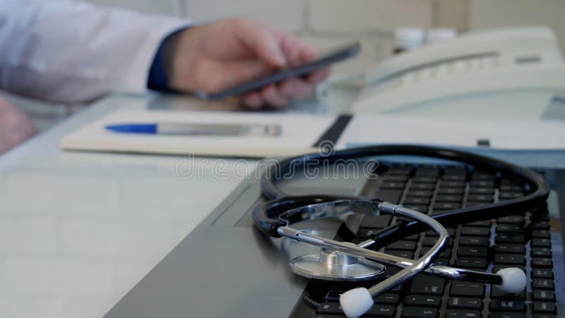 Image with a Doctor in Hospital Office Using Smartphone Communication ...