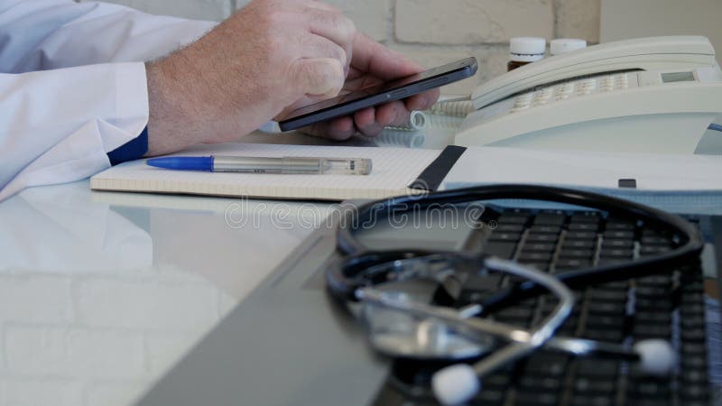 Image with a Doctor in Hospital Office Using Smartphone Communication ...