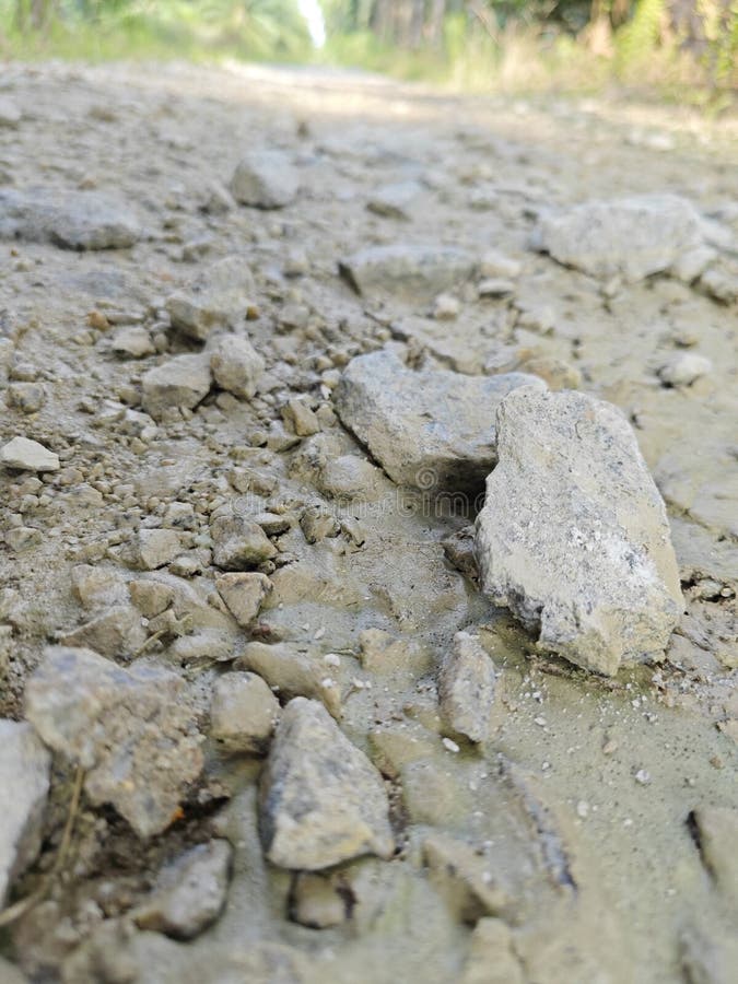 Dried Up Puddle Left with Stones Along the Pathway Stock Image - Image ...