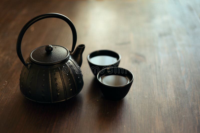 Image of Eastern Teapot and Teacups on Wooden Desk Stock Image - Image ...