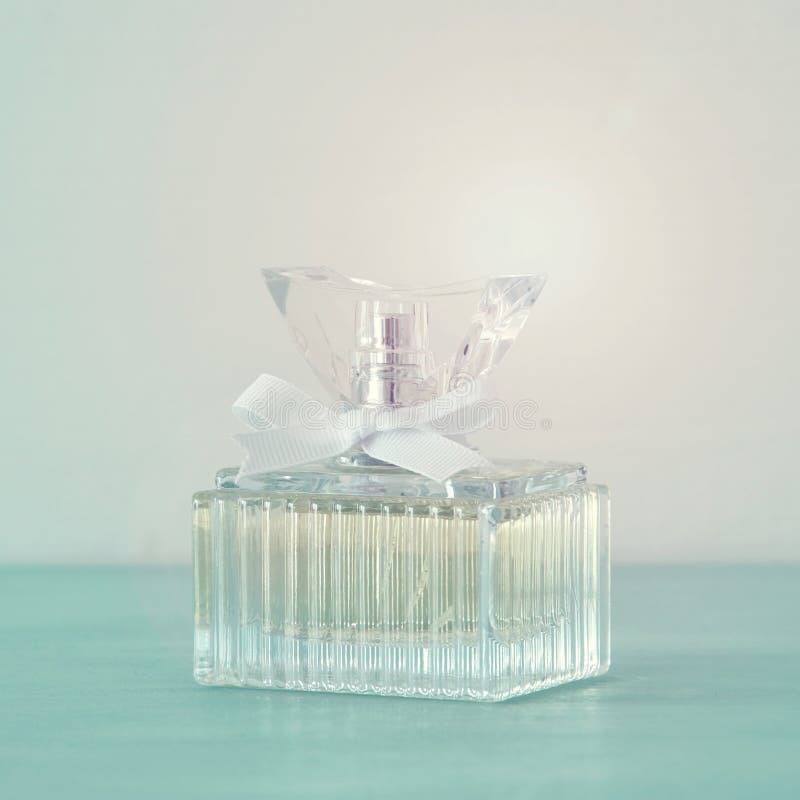 Image of Elegant Perfume Bottle. Back Light Photo. Vintage Filtered ...
