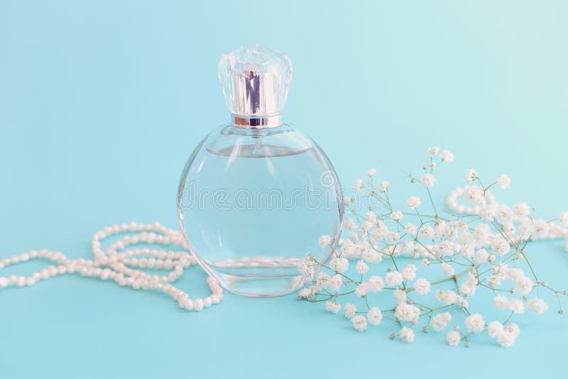 Image of Elegant Perfume Bottle Over Blue Pastel Background Stock Image ...