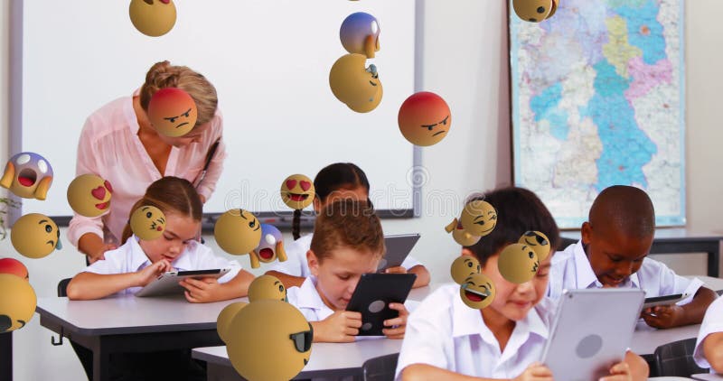 Image of Emoticons Floating Over Diverse Female Teacher Helping ...