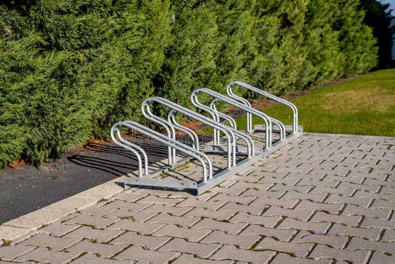 Empty Bicycle Parking Rack in Front of a Row of Hedges Stock Image ...