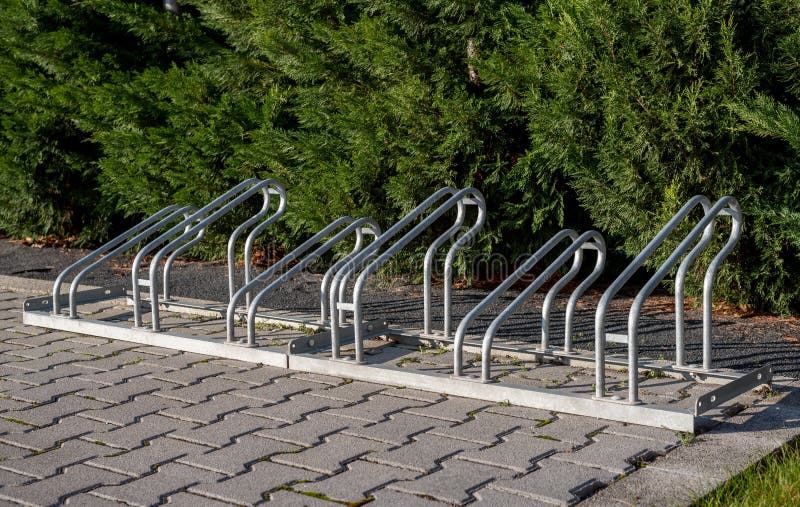 Empty Bicycle Parking Rack in Front of a Row of Hedges Stock Photo ...