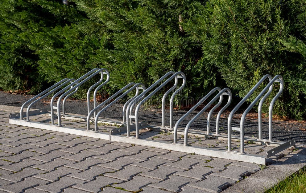 Empty Bicycle Parking Rack in Front of a Row of Hedges Stock Photo ...