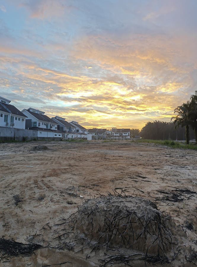 An Empty Plot of Land Scene Besides a Residential Row of Houses. Stock ...