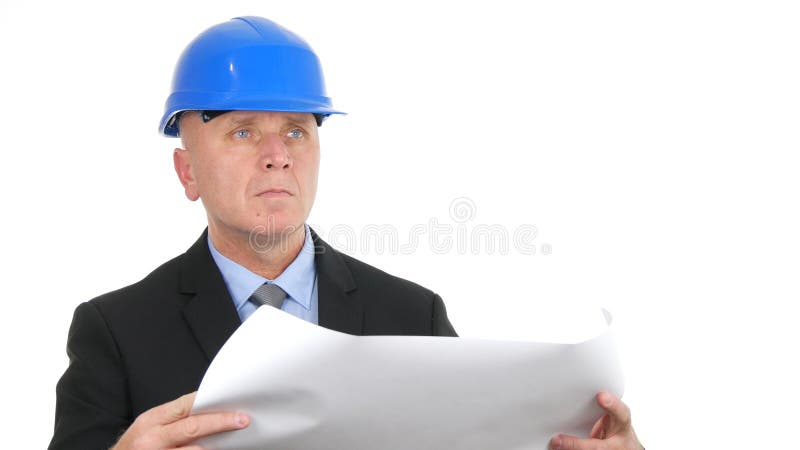 Image with Engineer Reading Technical Plans for a Building Construction ...