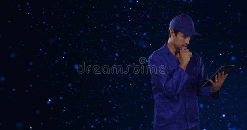 Image of Engineer Using Tablet Over Glowing Blue Spots in Background ...