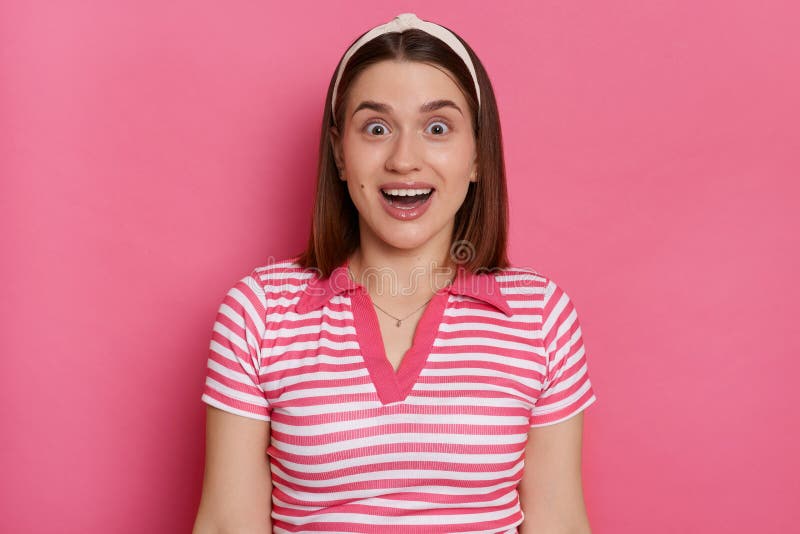 Image Of Excited Shocked Woman Wearing Striped T Shirt And Hair Band