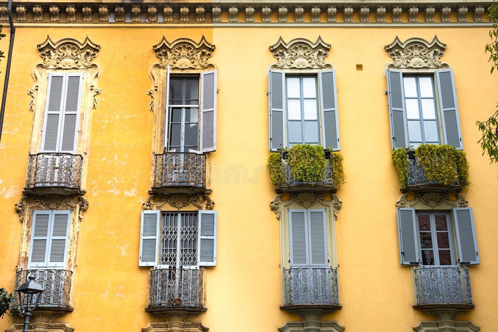 Facade of Old Yellow Building with Shuttered Windows Stock Image ...