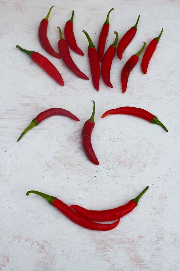 Image of Face Shaped Hot Chilli Peppers on White Background Stock Image ...