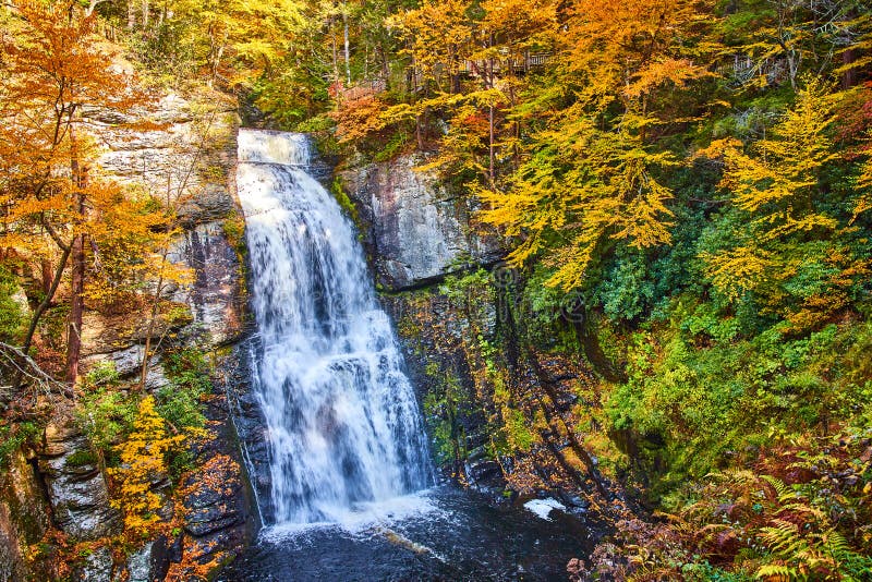 Fall Foliage Surrounds and Covers Cliffs Around Raging Waterfall into ...