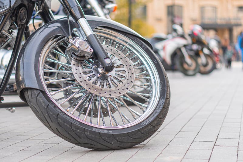 Image Features a Close-up of a Chrome Motorcycle Wheel Against a ...