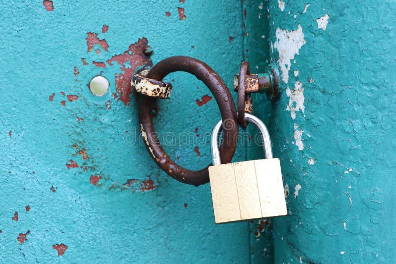 A Rusty Lock Positioned on a Weathered and Aged Surface, Signifying ...