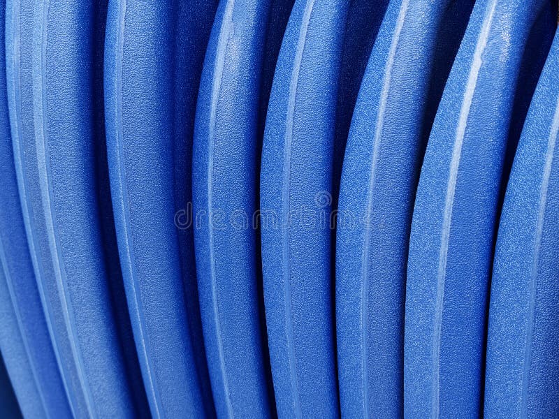 This Image Features a Closeup View of a Blue and Yellow Striped Plastic ...