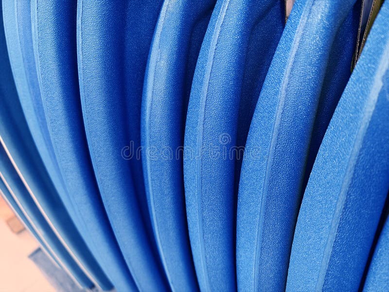 This Image Features a Closeup View of a Blue and Yellow Striped Plastic ...