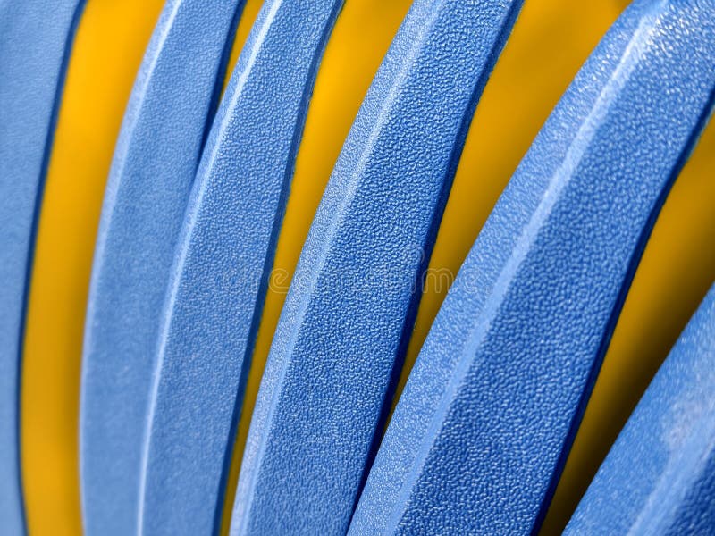 This Image Features a Closeup View of a Blue and Yellow Striped Plastic ...