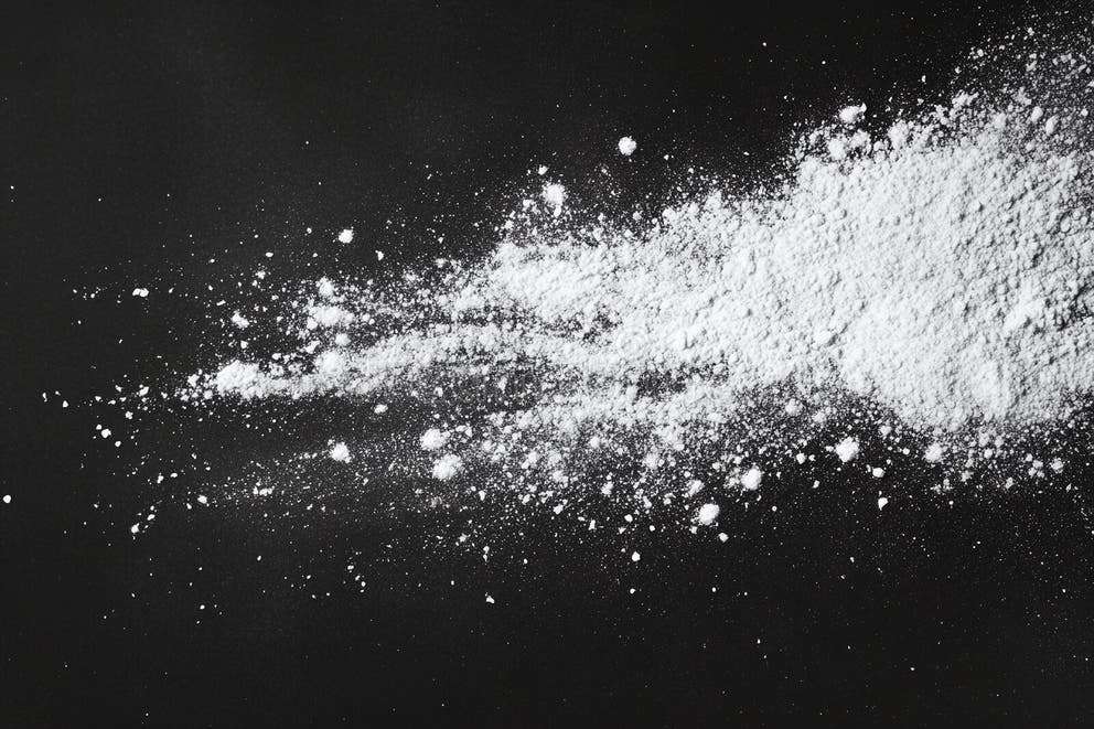 White Fine Powder Spread in Dynamic Pattern on Black Background ...