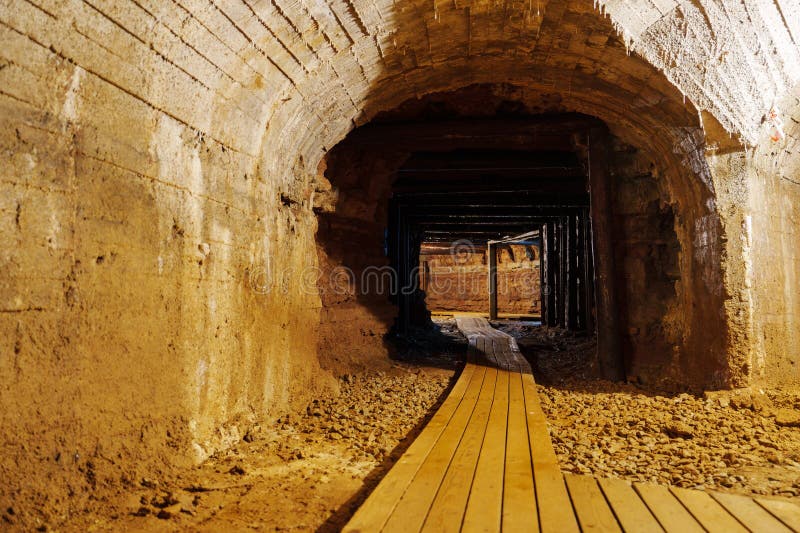 Long Underground Tunnel with Vaulted Stone Ceiling and Dim Light Stock ...