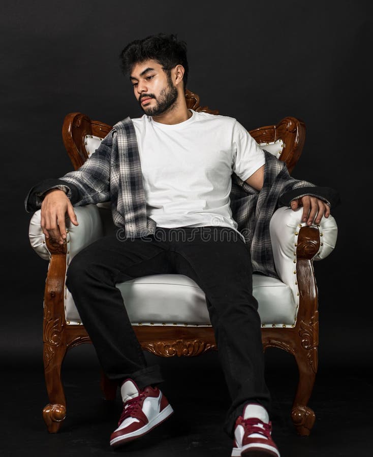 The Image Features a Man in a White Shirt, Elegantly Arranged with a ...