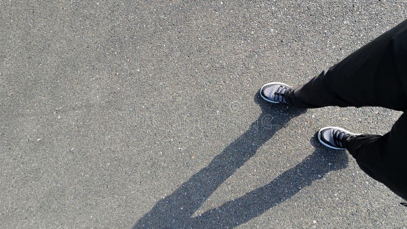 Image of feet and shadow stock image. Image of street - 376729365