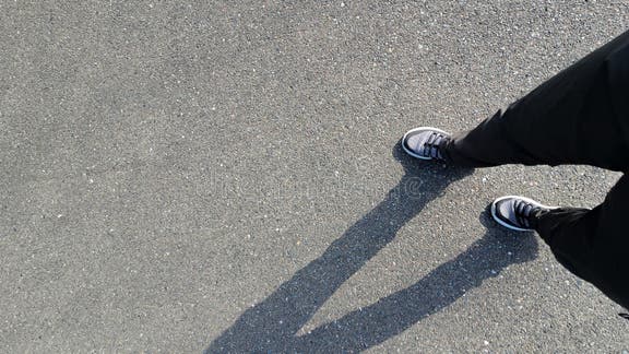 Image of feet and shadow stock image. Image of street - 376729365