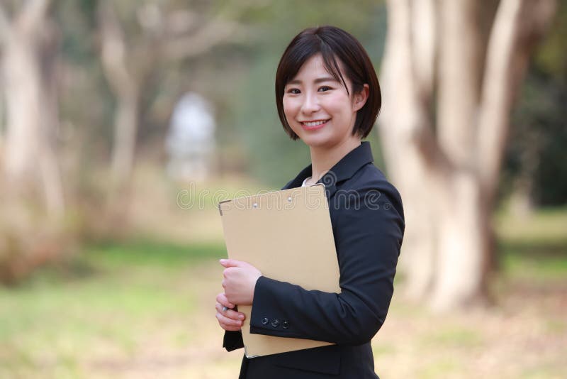 Female Employee with a Binder Stock Photo - Image of cute, office ...