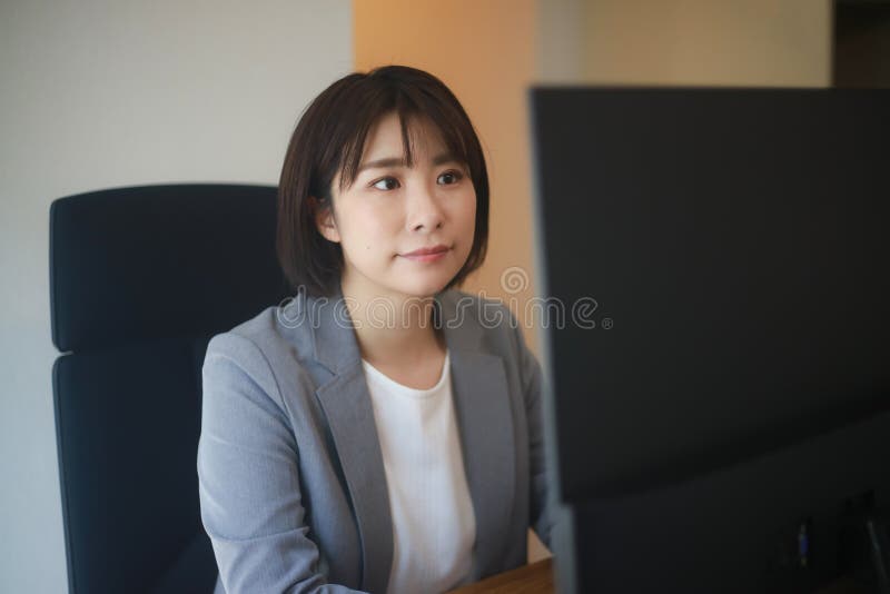 Female Employees Using Personal Computers Stock Image - Image of jacket ...