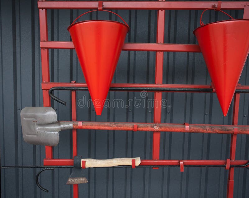 Image of a Fire Shield Consisting of Red Iron Buckets, a Shovel, an Ax ...