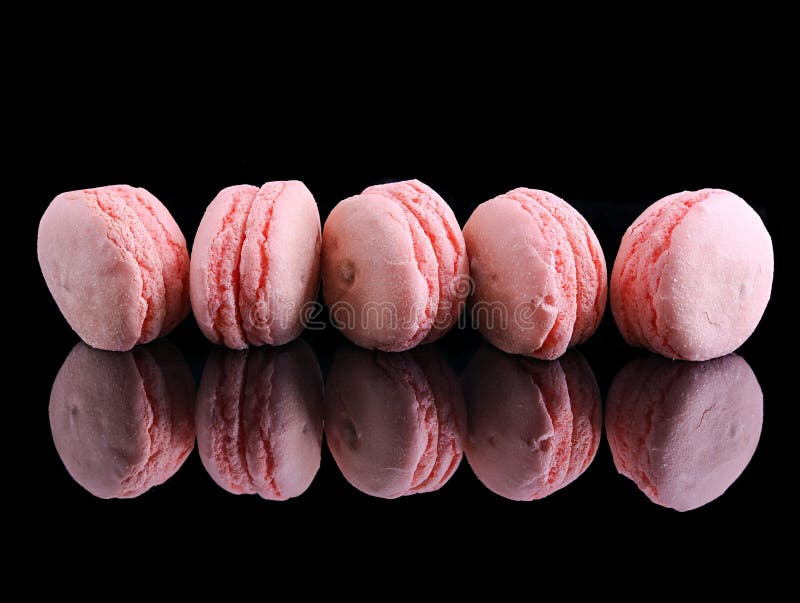 Five Different Types of Pink Candy Macarons on a Reflective Surface ...