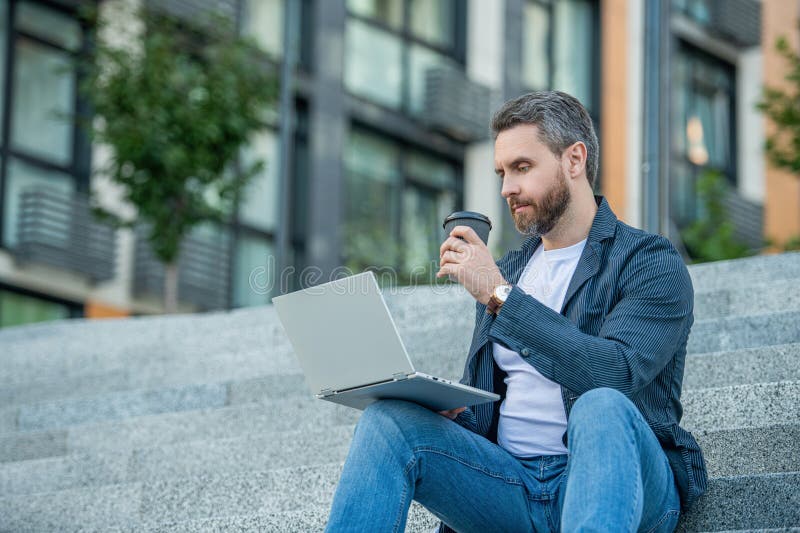 Image of Freelance Man with Computer. Freelance Man with Laptop Outdoor ...