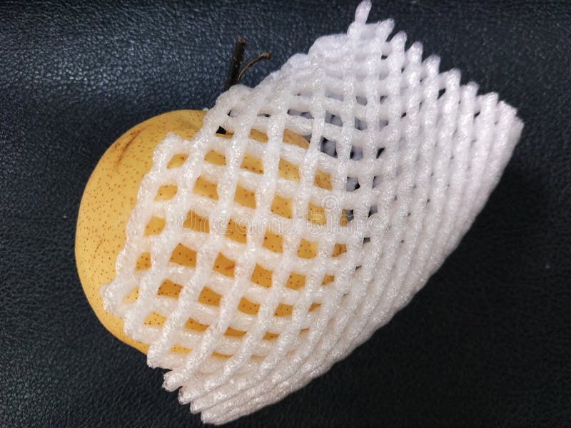 Fresh Pear with Net Fruit on Black Leather Board Stock Photo - Image of ...