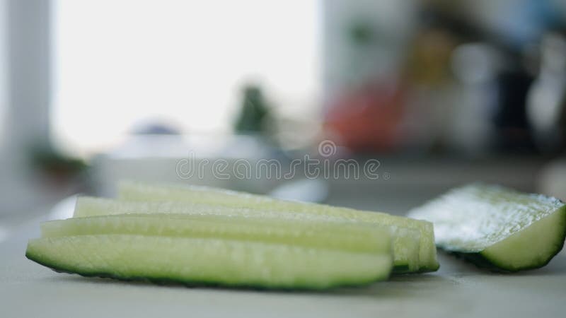 Image with a Fresh Tasty and Flavored Green Cucumber Cut in Long Slices ...