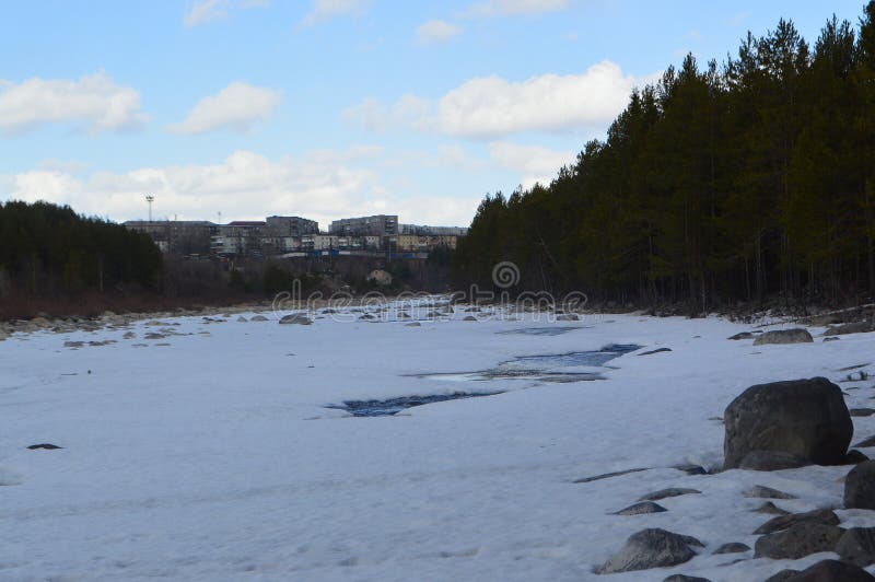 Frozen Niva river in April stock photo. Image of snow - 215737112