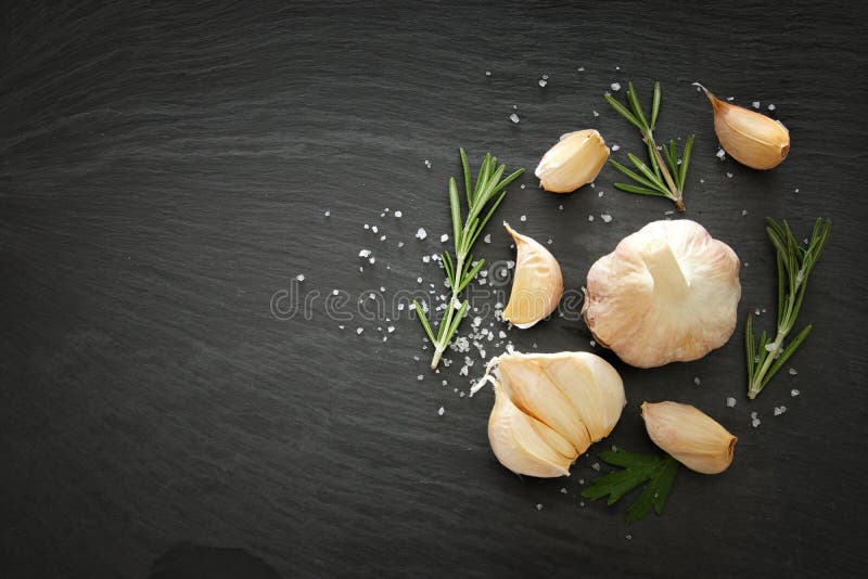 Image of Garlic and Rosemary on Slate Stone Plate Stock Image - Image ...
