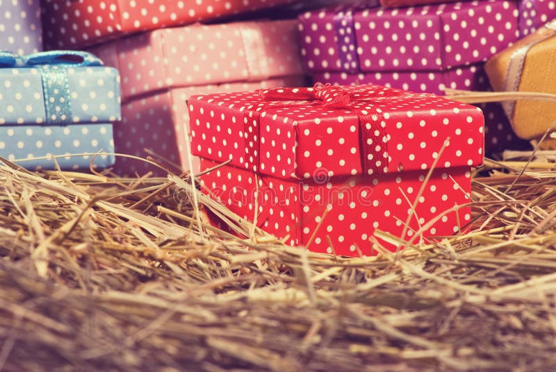 Image of Gift Boxes in the Hay Closeup Stock Image - Image of color ...