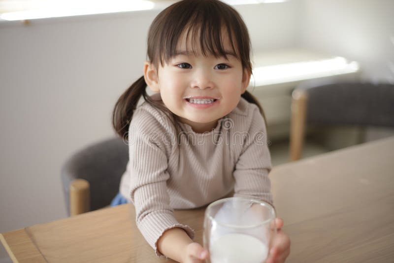 Girl drinking milk stock image. Image of drink, tasty - 325013027