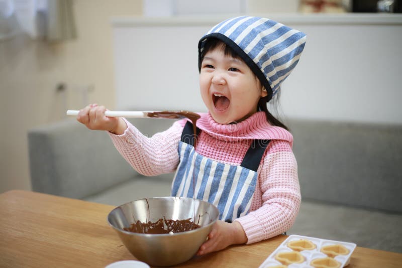 Girl making sweets stock image. Image of indoors, bowl - 241905293