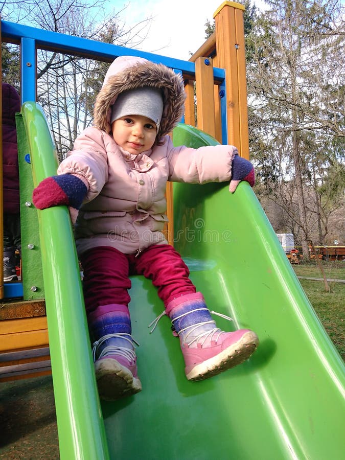 Girl on slide stock image. Image of slip, friends, happy - 8494155
